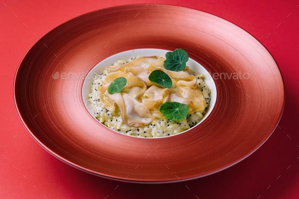 white fish fillet served with steamed rice in a beautiful red bowl ...