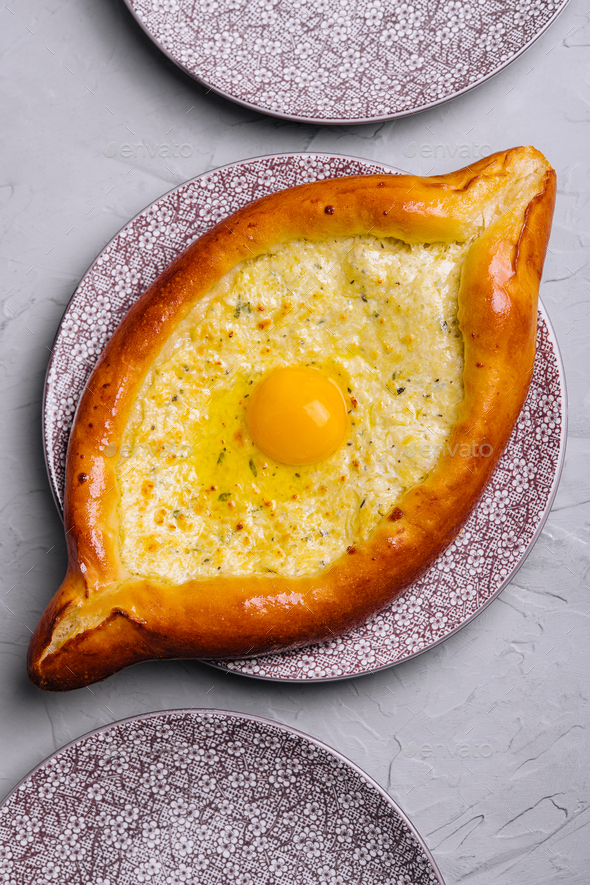 Georgian cuisine ajaruli khachapuri - georgian bread with egg and ...