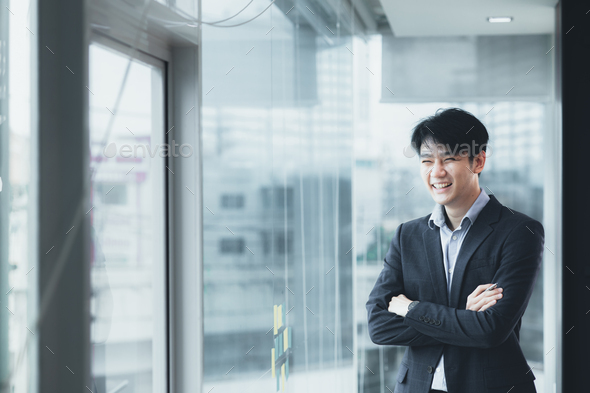 Asian man with suit, young businessman as startup company CEO ...