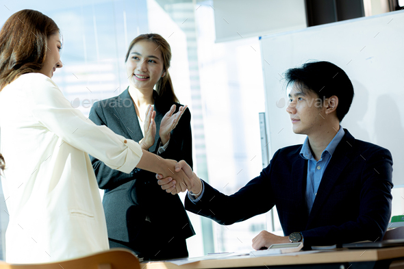 Business dealings and handshakes, startup company marketing team ...