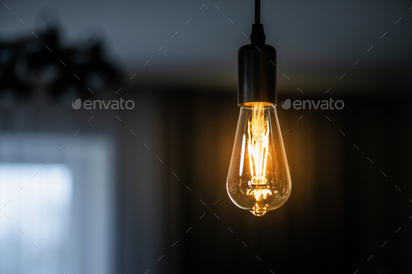 Vintage hanging Edison light bulb Stock Photo by ivankmit | PhotoDune