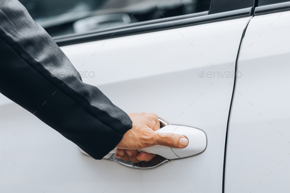Man opening car doors to drive to work, using vehicles to travel safely ...