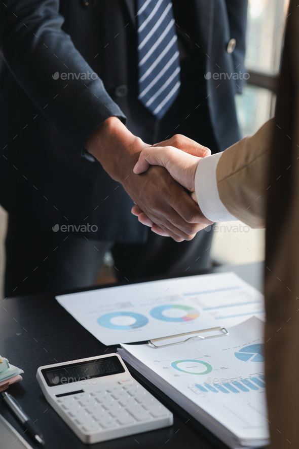 Business investor group holding hands, Two businessmen are agreeing on ...