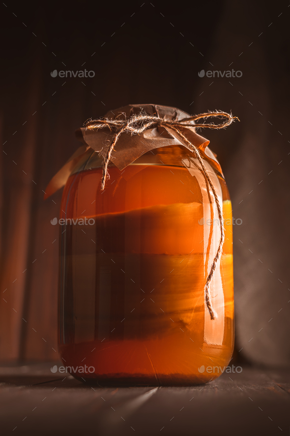 kombucha with layers in a large three-liter jar Stock Photo by iloli