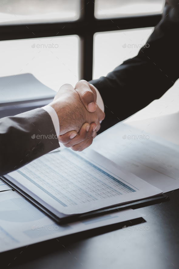 Business investor group holding hands, Two businessmen are agreeing on ...