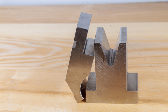 Bending tool on a wooden background. Sheet metalworking cnc press brake ...
