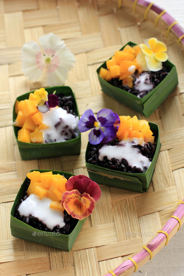 Homemade Coconut Black Sticky Rice with Mango in Pandan Leaves Cup ...