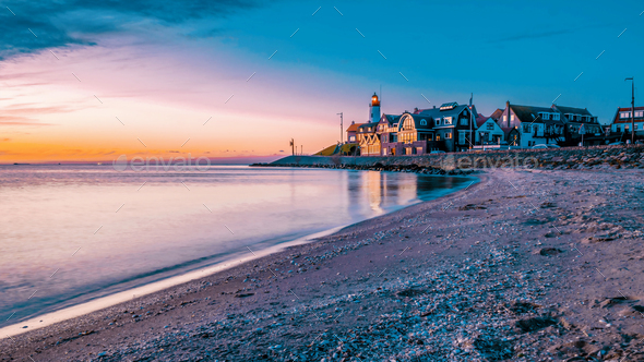 Urk Flevoland Netherlands sunset at the lighthouse and harbor of Urk ...