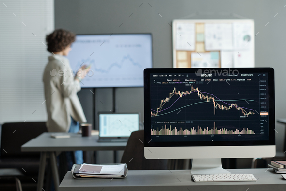 Computer screen with financial statistics illustrated by graph and ...