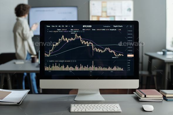 Screen of computer with financial chart and graph created by analyst ...