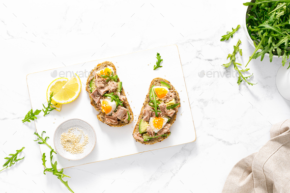 Tuna toast. Open sandwiches with whole grain bread, canned tuna, boiled ...