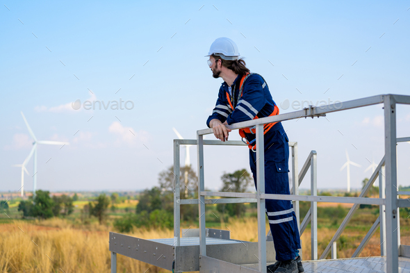 Renewable energy engineer working on wind turbine Stock Photo by 1footage