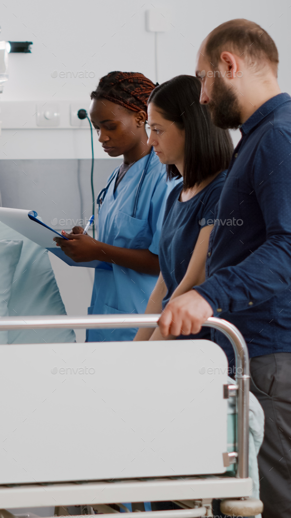 Physician pediatric doctor monitoring disease symptoms while african ...