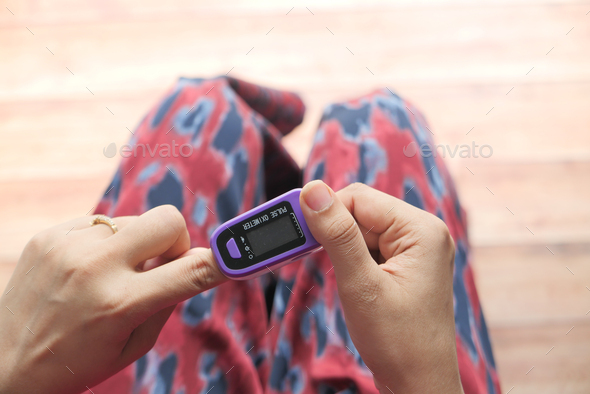young women hand using pulse oximeter Stock Photo by towfiqu98 | PhotoDune