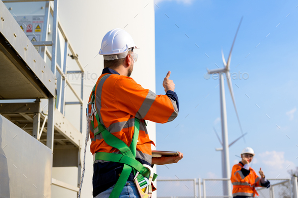 Renewable energy engineer working on wind turbine Stock Photo by 1footage