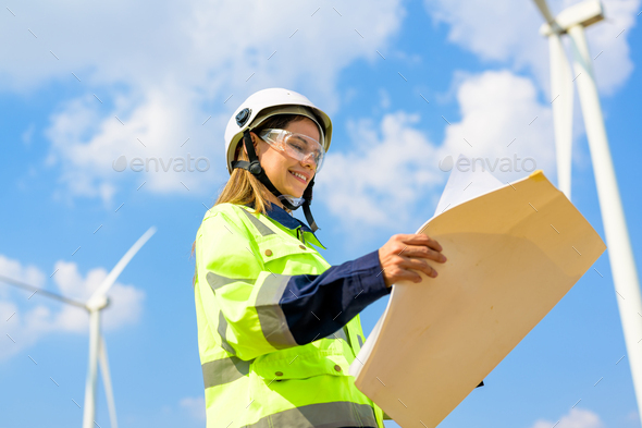 Renewable energy engineer working on wind turbine Stock Photo by 1footage