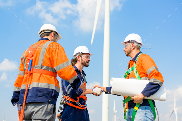 Renewable energy engineer working on wind turbine Stock Photo by 1footage