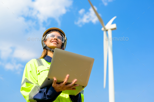 Renewable energy engineer working on wind turbine Stock Photo by 1footage