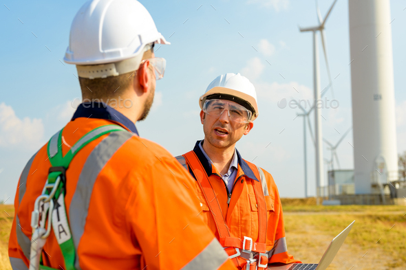 Renewable energy engineer working on wind turbine Stock Photo by 1footage