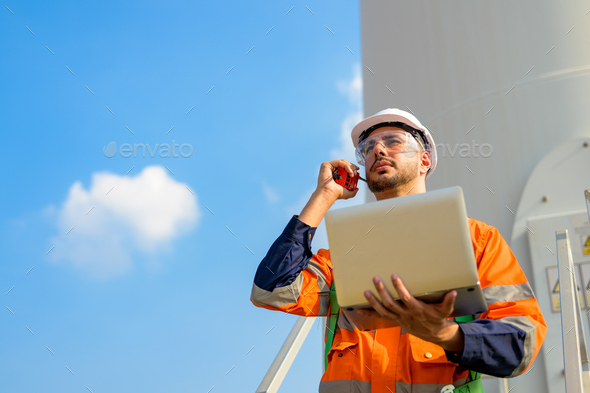 Renewable energy engineer working on wind turbine Stock Photo by 1footage