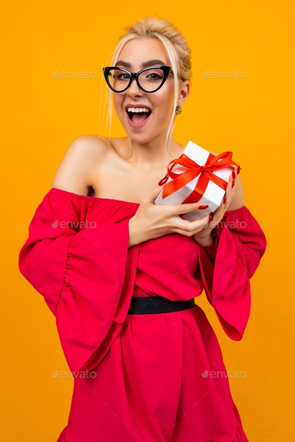 pleasantly surprised attractive lady in a red dress received a white ...