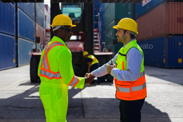 Warehouse engineer working at container yard Stock Photo by 1footage