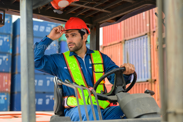 Warehouse engineer working at container yard Stock Photo by 1footage