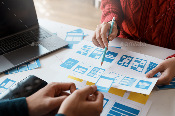 Designer, programmers, developers of mobile applications work together to invent a modern mobile ...