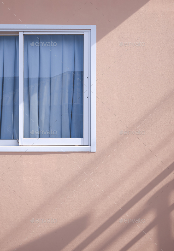 Sunlight and shadow on surface of Glass sliding window with blue ...