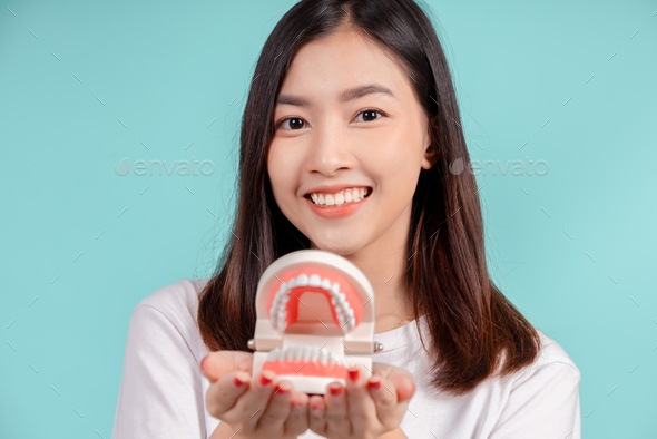 Dental of asian woman with tooth sample and white teeth increase ...