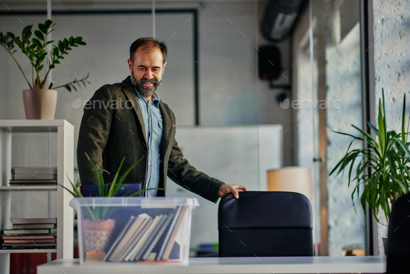 Middle adult man setting office table Stock Photo by bernardbodo ...