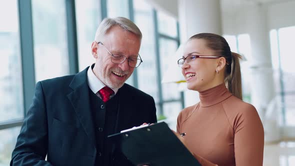 Office workers speaking happily., Stock Footage | VideoHive