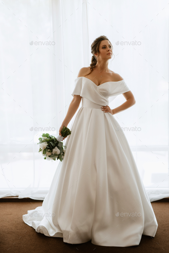 preparations for the bride with the dressing of the wedding dress Stock ...