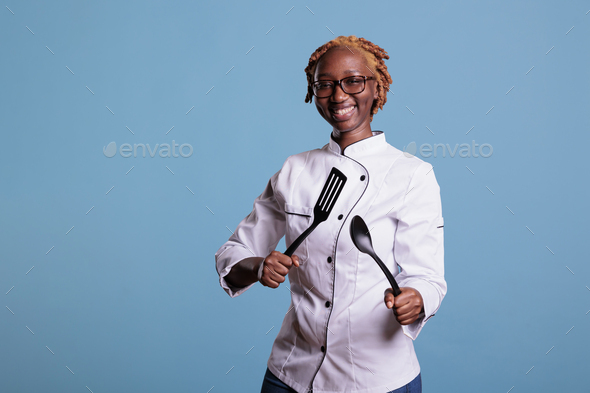 Curly haired chef portrait posing with kitchen utensils Stock Photo by ...