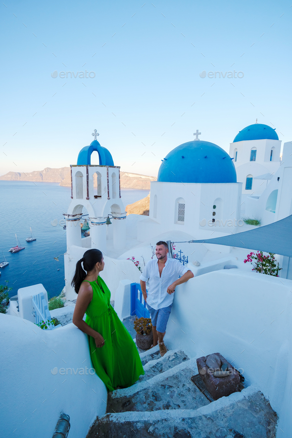 Couple on vacation in Santorini Greece, men and women at the Greek ...