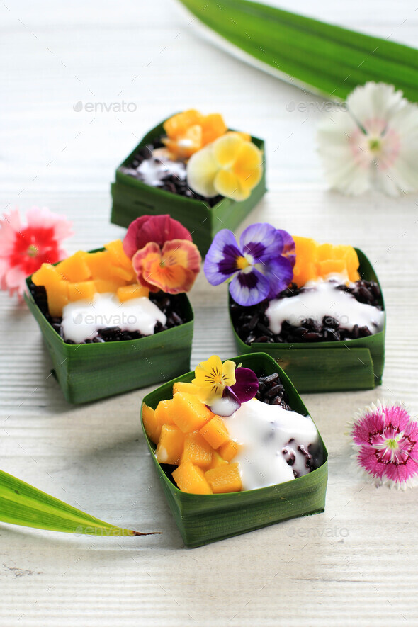 Homemade Coconut Black Sticky Rice with Mango in Pandan Leaves Cup ...