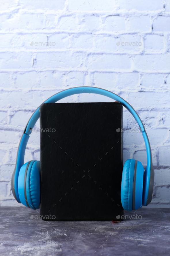 Audio book concept. Headphones and notepad on white background Stock ...