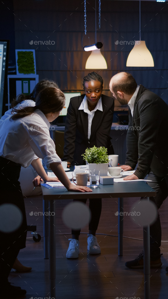 Diverse multi ethnic businesspeople teamwork lean on conference table ...