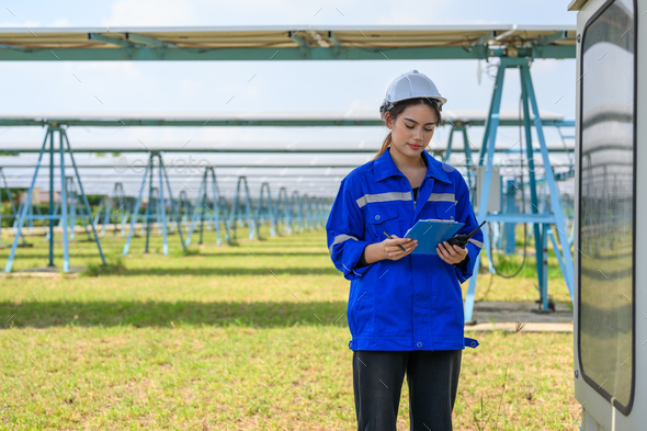 Workers installing solar panels, Engineer team at solar panel farm ...