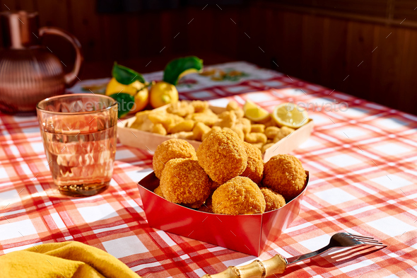 Typical Sicilian street food arancini (deep fried rice balls with meat ...