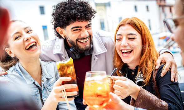 Trendy people having fun drinking at open air bar dehor cocktails on ...