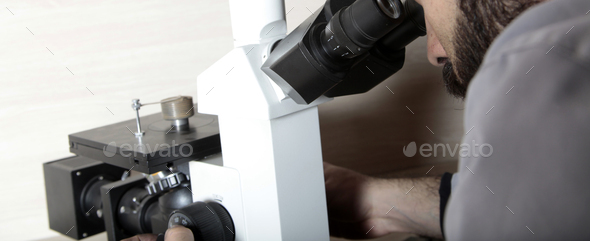 Examination with a microscope. Metal hardness measurement. Stock Photo ...