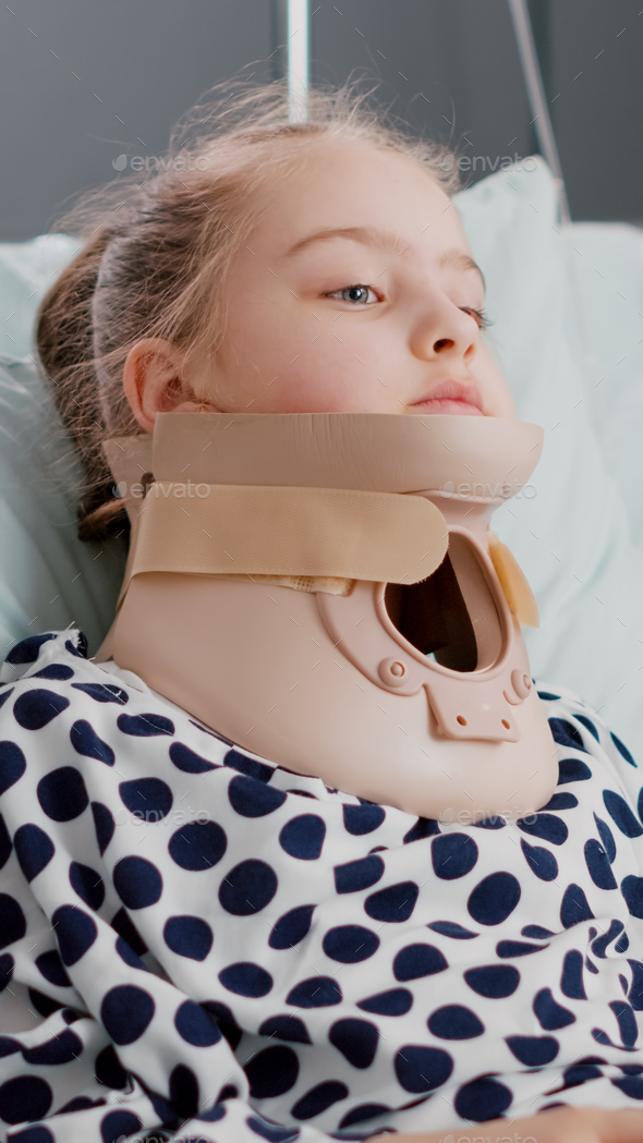 Portrait of hospitalized little child wearing neck cervical collar ...
