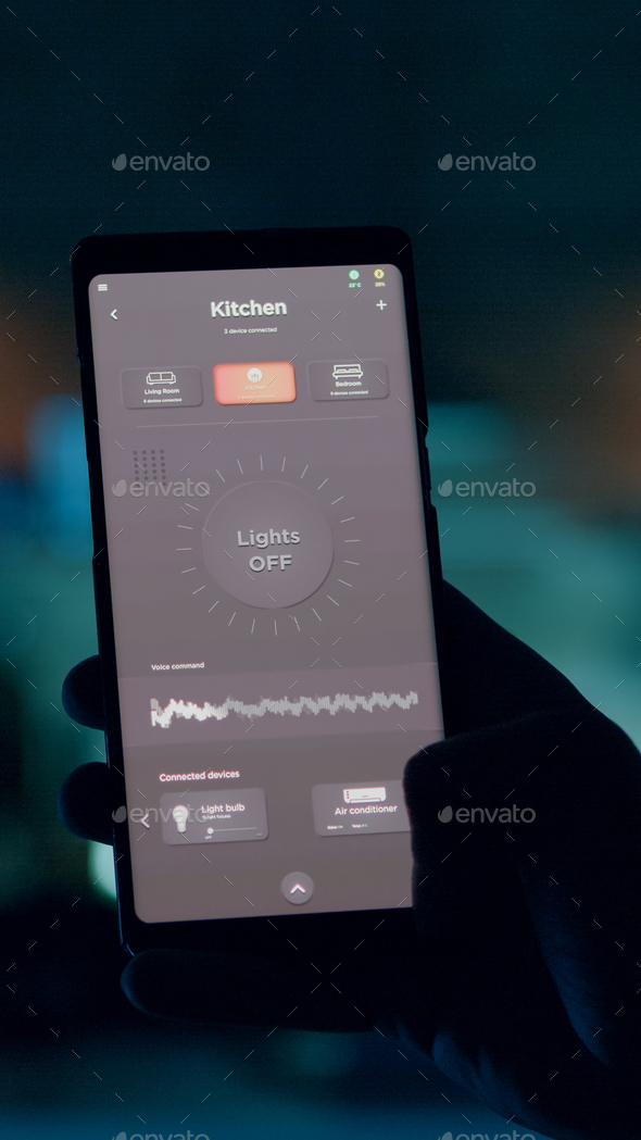 Person controlling ambient light using smart home application touching ...