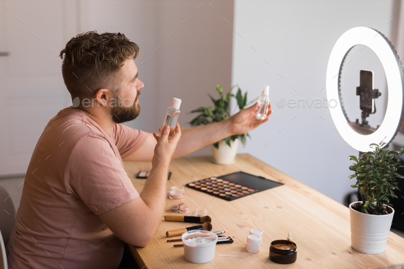 Man vlogging about make up and beauty products. Male shooting a makeup ...