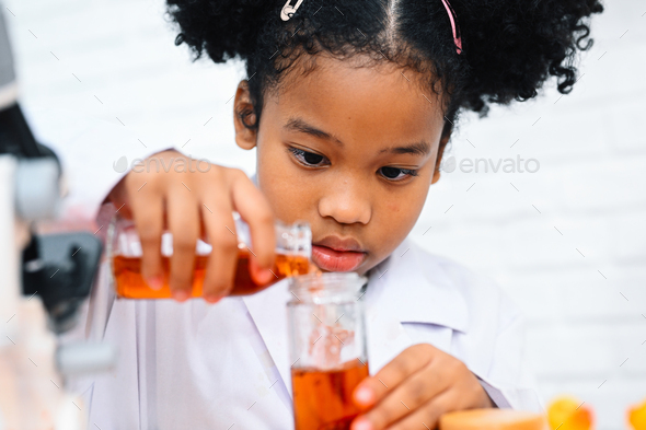 Child in classroom at school, Kid dressed Science lab coat. Science ...