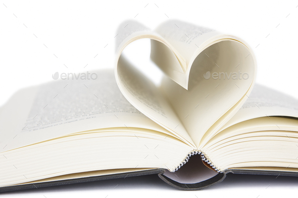 Open book with heart shaped pages. Love for reading Stock Photo by ABBPhoto