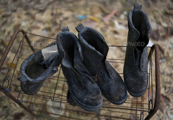 old damaged work rubber boots Stock Photo by hmzphotostory | PhotoDune