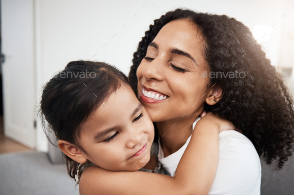 Hug, love and girl with mother on a sofa, happy and smile while hugging ...
