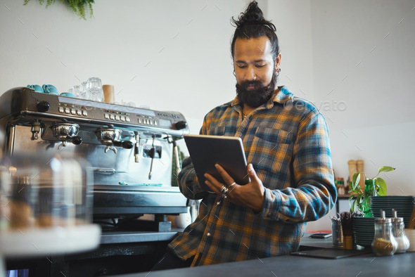 Tablet, barista man and cafe employee working on digital retail shop ...